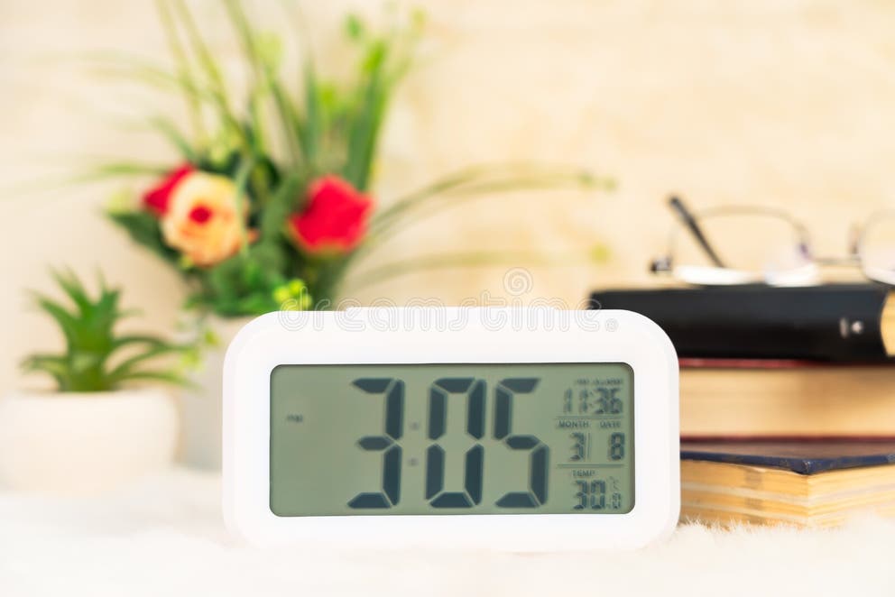 Digital Clock with Book Decorated on Table Stock Photo - Image of ...