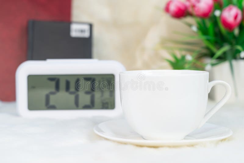 Digital Clock and Cup of Coffee Stock Photo - Image of room, closeup ...