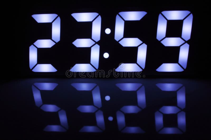 Illuminated Digital Clock Displaying Midnight Hour Stock Photos - Free ...