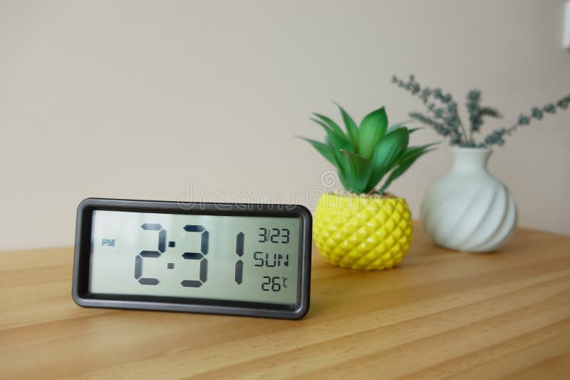 Digital Clock Displaying Time and Temperature in Cozy Indoor Setting ...