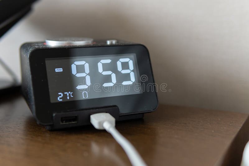 A Digital Clock on Table Showing 9.59 am Morning Stock Image - Image of ...