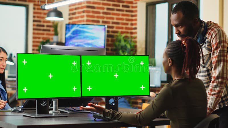 Digital Company Employees Using Greenscreen Display on Computers Stock ...