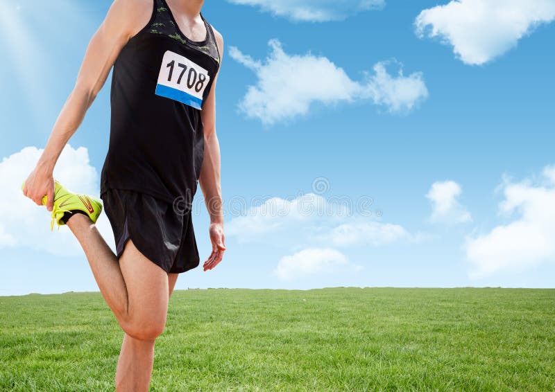 Athlete Stretching Leg in Front of Field and Sky Stock Image - Image of ...