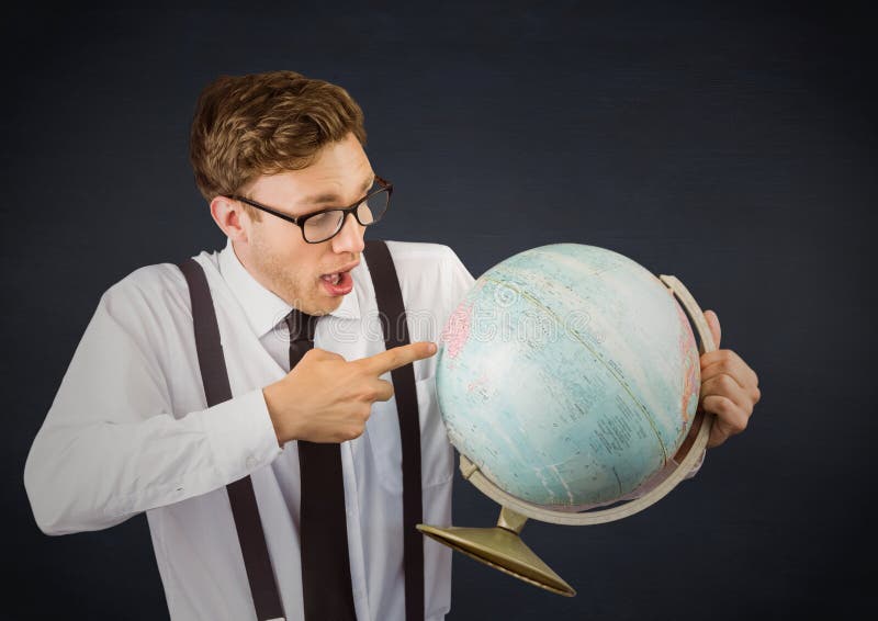 Nerd Man Pointing at Globe Against Navy Chalkboard Stock Image - Image ...