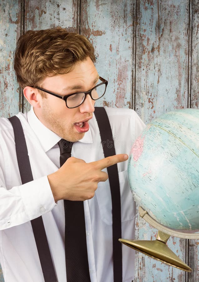 Nerd Man Pointing at Globe Against Brown Background Stock Image - Image ...