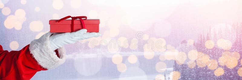 Santa holding gift in hand stock photo. Image of gift - 103815520