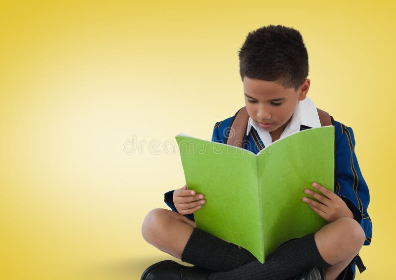 Schoolboy Reading in Front of Yellow Background Stock Image - Image of ...