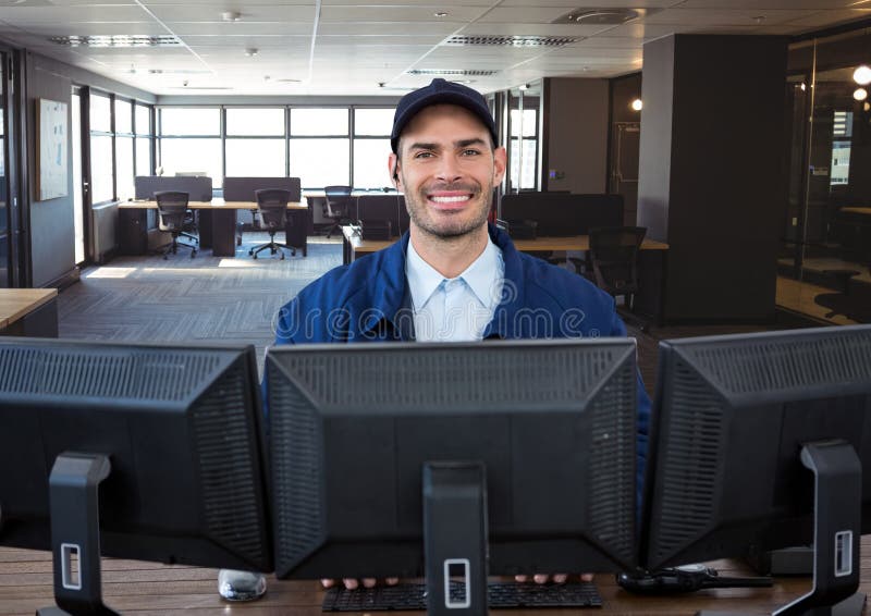 Security Guard Behind the Screens, Smiling. in the Office Stock Photo ...