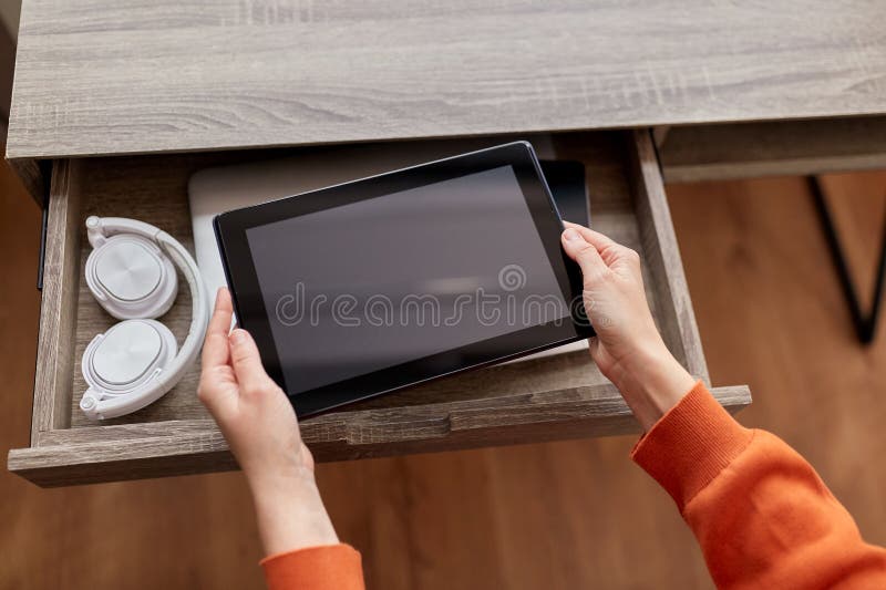 Hands and Different Gadgets in Desk Drawer at Home Stock Photo - Image ...