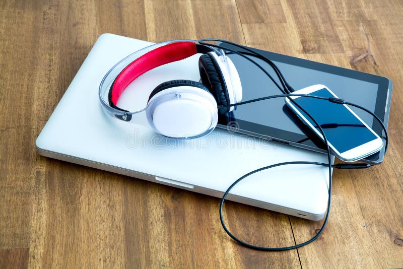 Headphones and a Laptop Computer on a Desktop Stock Photo - Image of ...