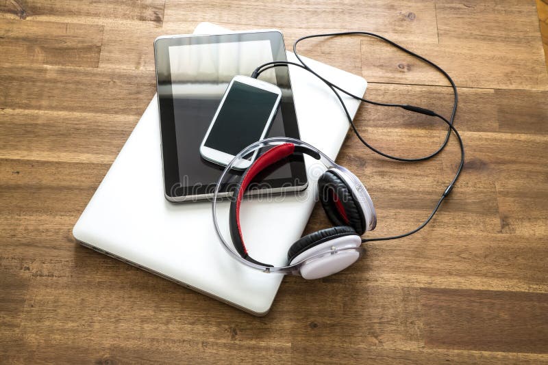 Digital Devices and Headphones on a Wooden Desktop Stock Photo - Image ...