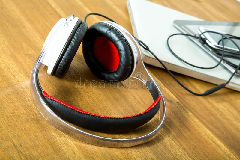Digital Devices and Headphones on a Wooden Desktop Stock Image - Image ...