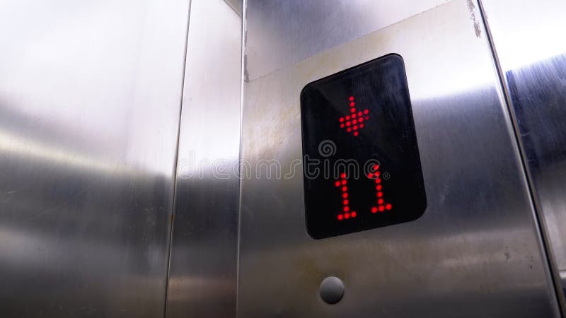 Digital Display in the Elevator with Arrow Down Shows Floors from 15st ...