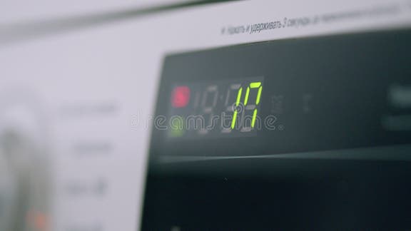 The Digital Display Timer on Your Washing Machine Shows the Progress of ...