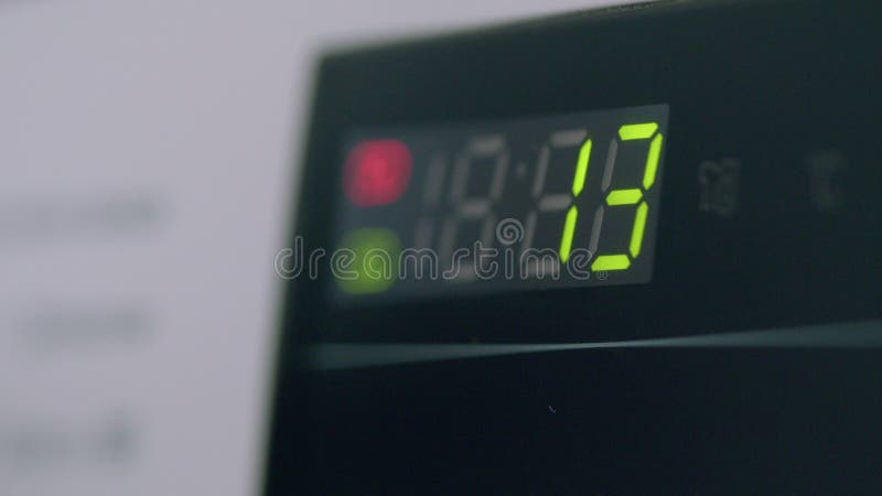 The Digital Display Timer on Your Washing Machine Shows the Progress of ...