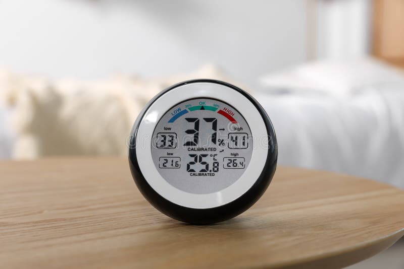 Digital Hygrometer with Thermometer on Wooden Table Indoors Stock Photo ...