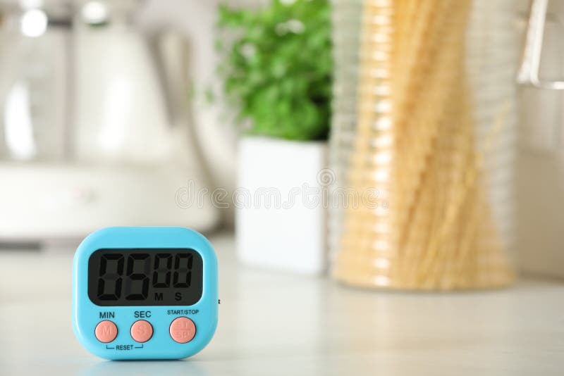Digital Kitchen Timer on White Table Indoors. Space for Text Stock ...