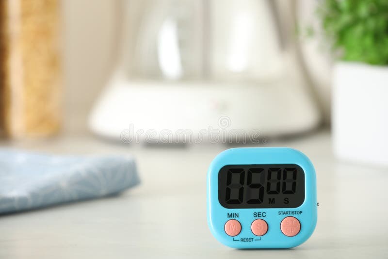 Digital Kitchen Timer on White Table Indoors. Space for Text Stock ...
