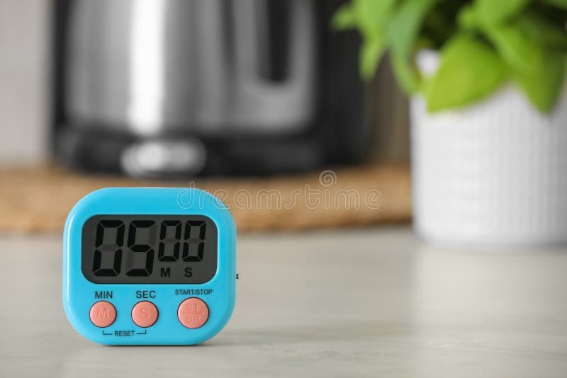 Digital Kitchen Timer on White Table Indoors. Space for Text Stock ...