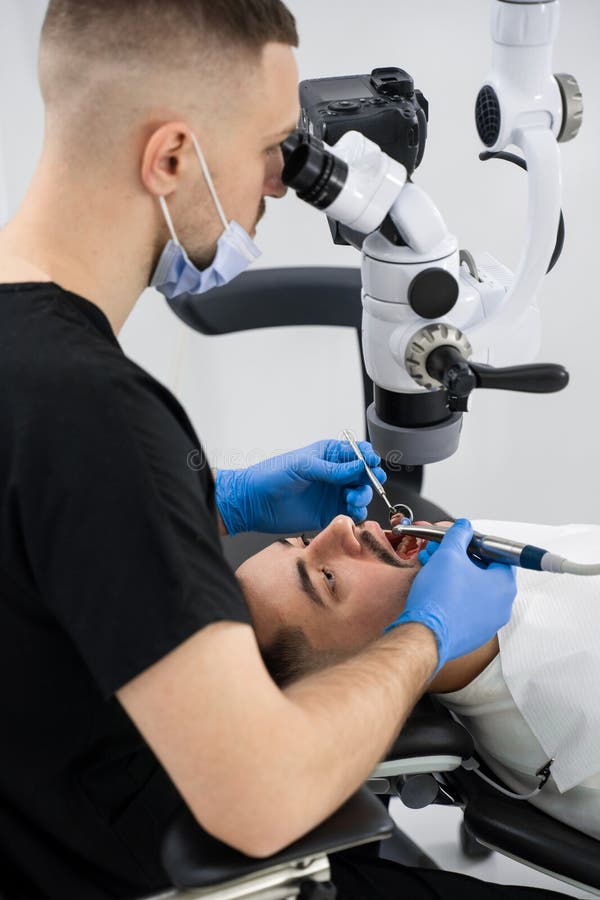 Digital Microscope Diagnostic by Dentist. Polishing Teeth with Digital ...