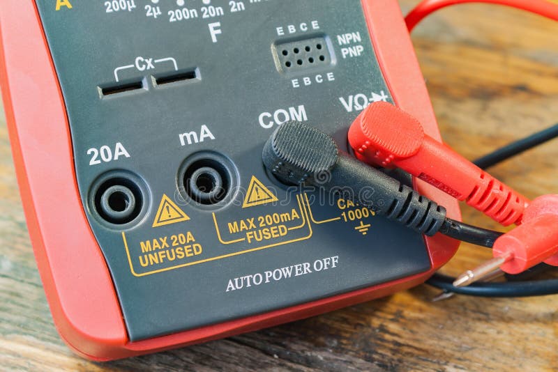 Digital Multimeter with the Connected Probes on a Table in a Workshop ...