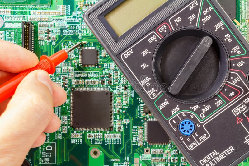 Digital Multimeter with Probe and Soldering Iron in the Engineer`s ...