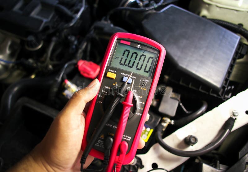 Digital Multimeter in the Hands of Mechanics for Measuring Car ...