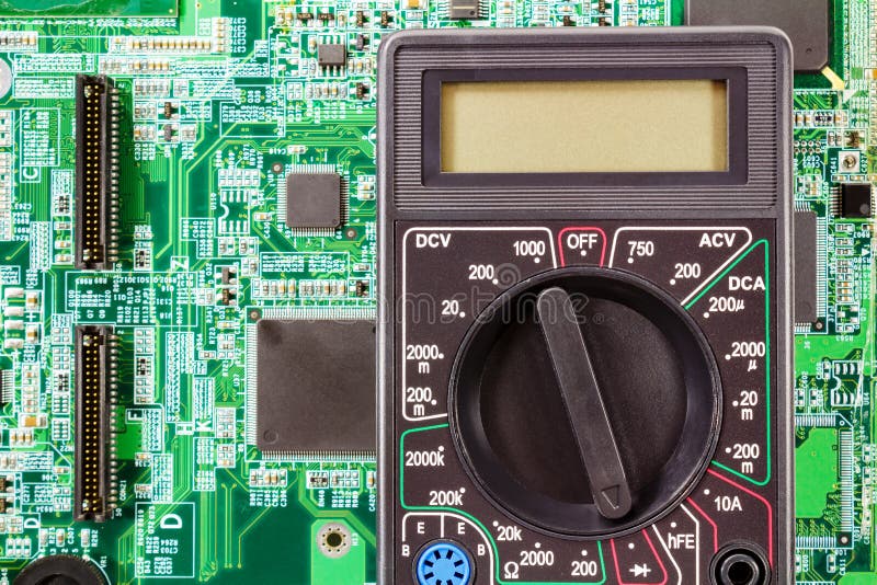 Digital Multimeter on a Printed Circuit Board Closeup Stock Photo ...
