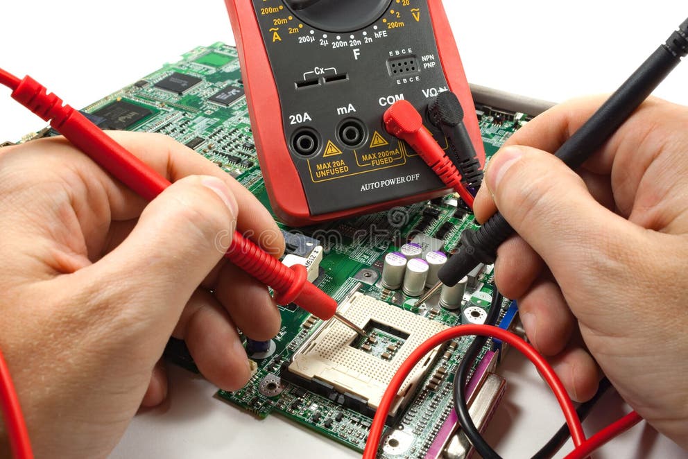 Digital Multimeter with Probe in the Master`s Hands in a Workshop Stock ...