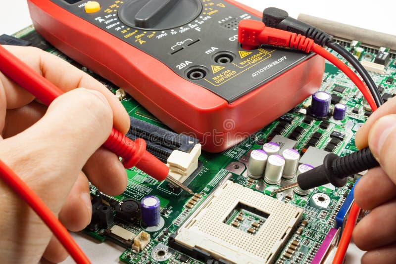 Digital Multimeter with Probe in the Master`s Hands in a Workshop Stock ...