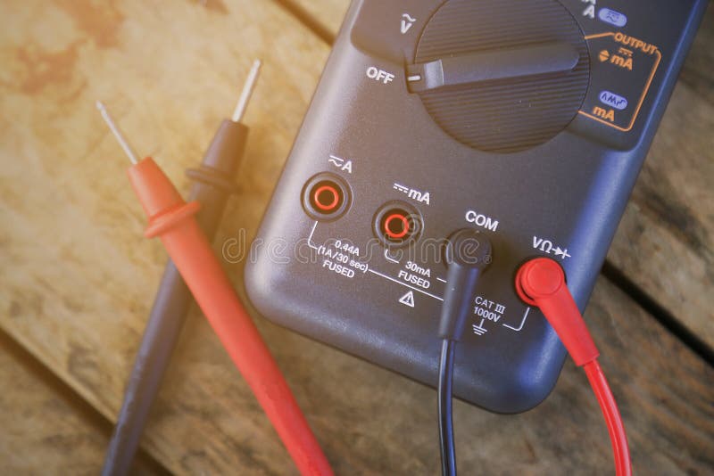 Digital Multimeter and Wiring on Wooden Table. Special Tools of ...