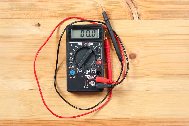 Digital Multimeter and Wiring on Wooden Table. Special Tools of ...