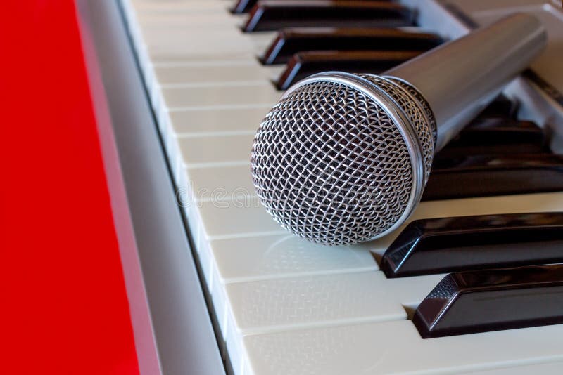 Digital Piano Keyboard with Microphone on Red Bacground Stock Image ...