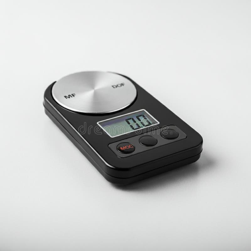 Digital Pocket Scale with a Sleek Black Casing and Round Metallic ...