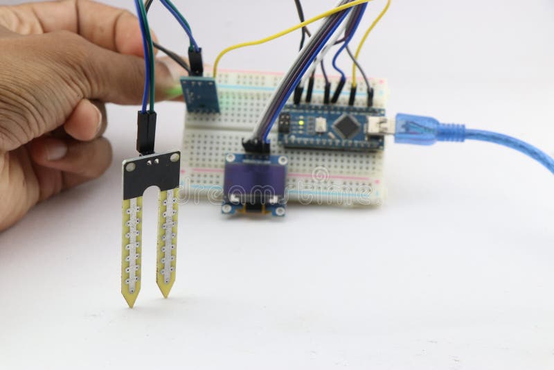 Soil Moisture Sensor with Some Breadboard Circuit Using a Programmable ...