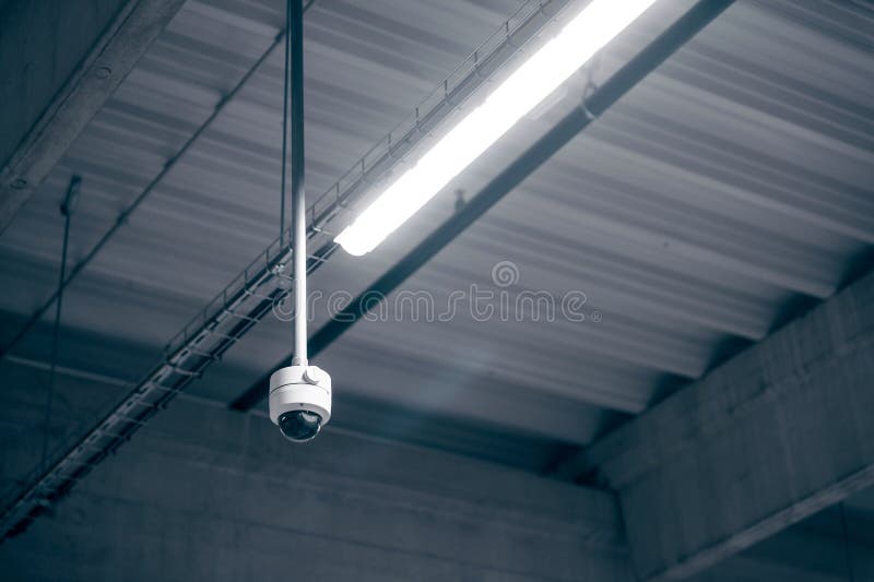 Digital Surveillance Camera on the Ceiling in a Warehouse Room Stock ...