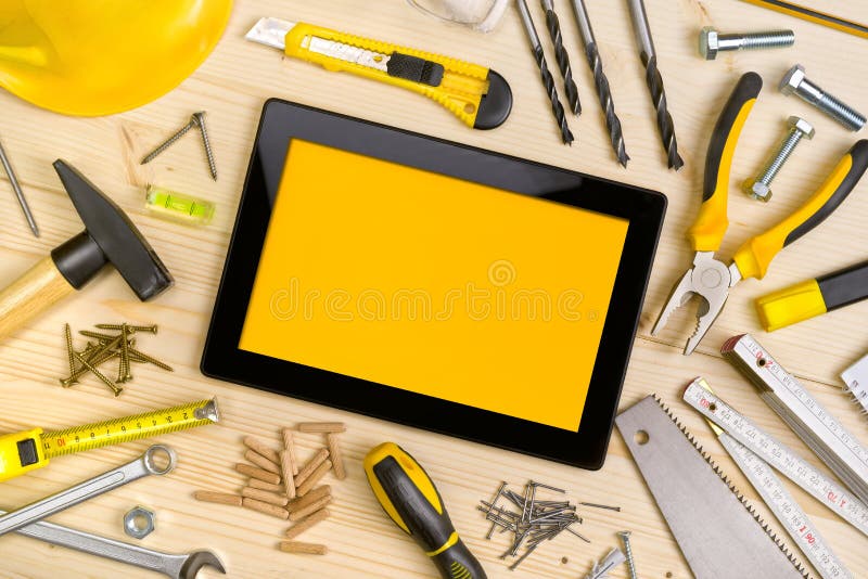 Digital Tablet and Assorted Carpentry Tools on Workshop Table Stock ...