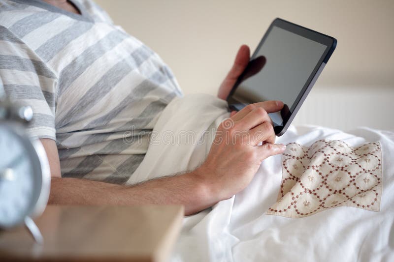 Digital tablet in bed stock photo. Image of information - 24292394
