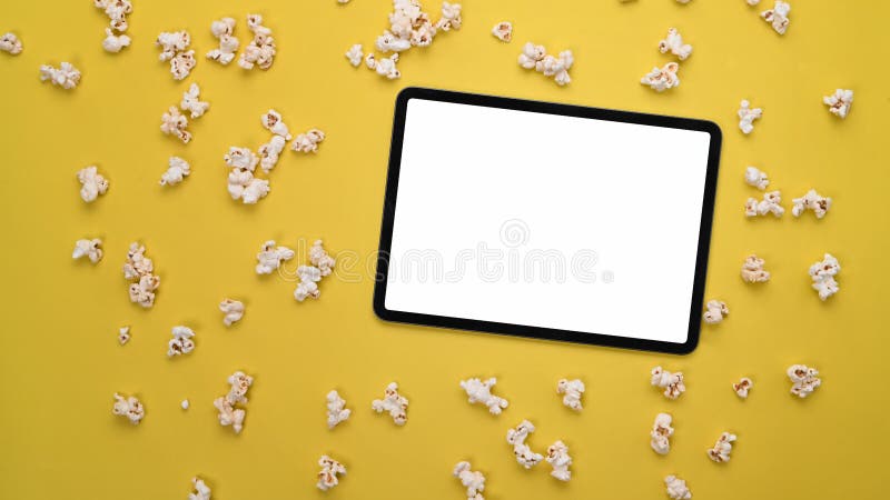 DTablet Black Screen with Popcorn on Yellow Background. Stock Photo ...