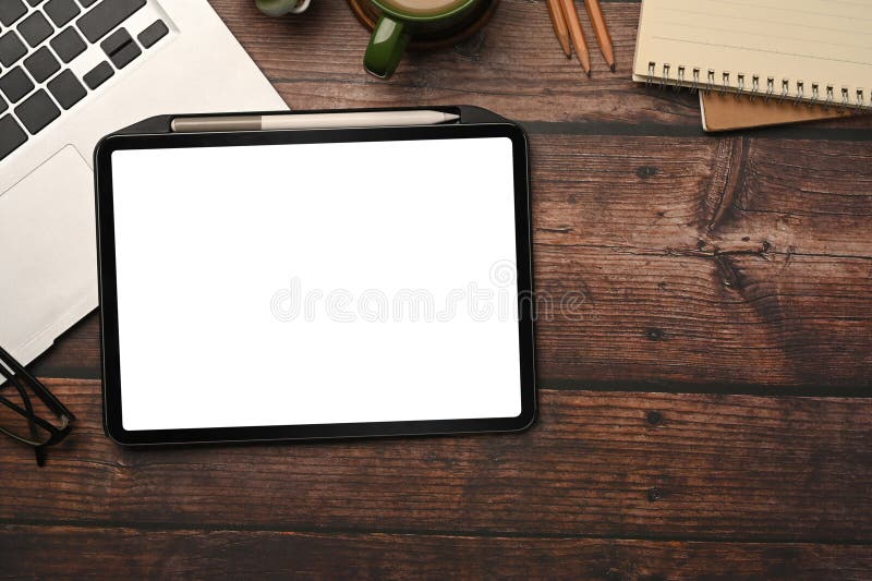 Digital Tablet with Blank Screen, Coffee Cup, Notepad and Laptop on ...