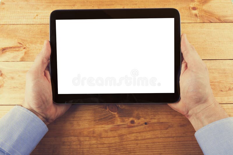 Digital Tablet with Blank Screen in Hands on the Wooden Table Stock ...