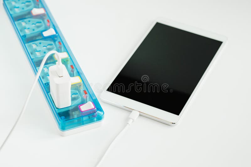 Digital Tablet is Charging with Extension Socket on White Background ...