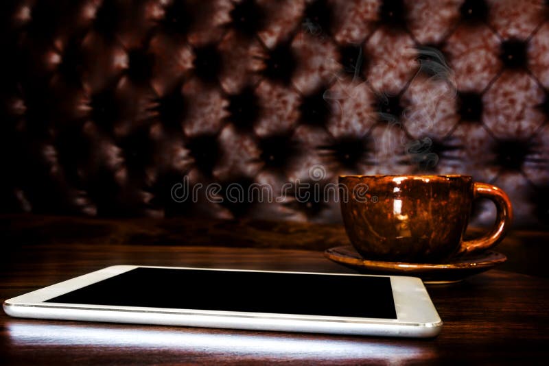 Digital Tablet and Coffee Cup on Wooden Table Stock Photo - Image of ...
