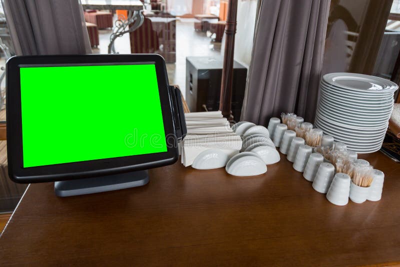 Digital Tablet Computer Green Screen in a Cafe on the Table. Stock ...