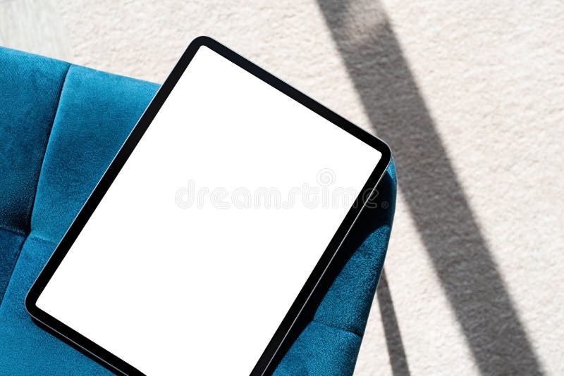 Digital Tablet Computer with Isolated Screen on Blue Chair. at Home ...