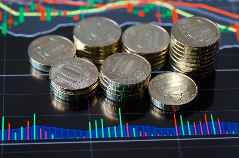Digital Tablet Display with Graph and Stack of Coins. Stock Image ...