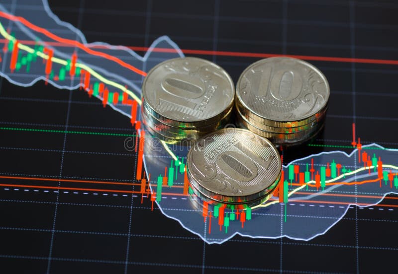 Digital Tablet Display with Graph and Stack of Coins. Stock Image ...