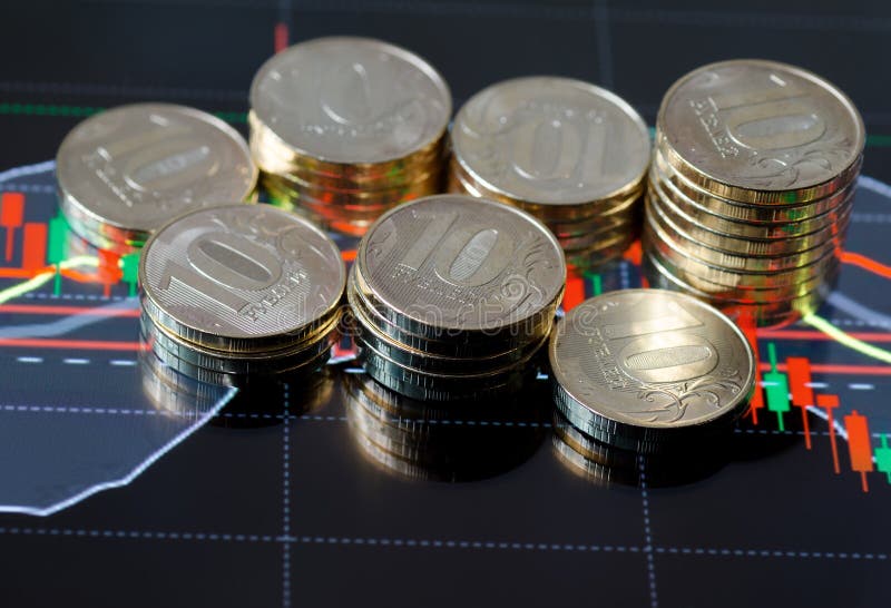 Digital Tablet Display with Graph and Stack of Coins. Stock Image ...