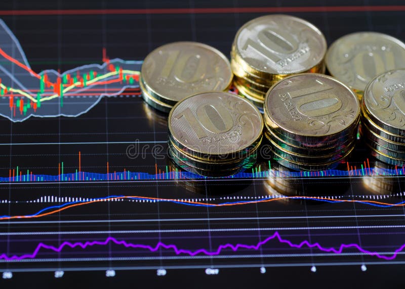 Digital Tablet Display with Graph and Stack of Coins. Stock Photo ...