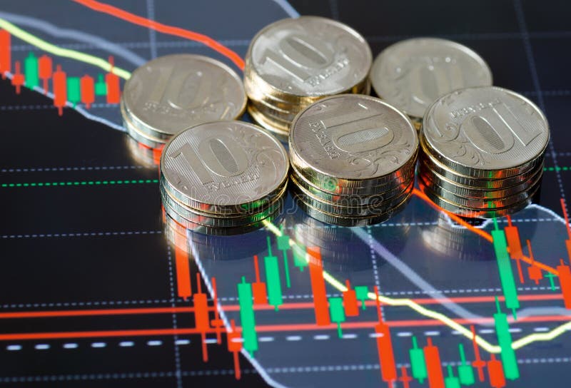 Digital Tablet Display with Graph and Stack of Coins. Stock Photo ...